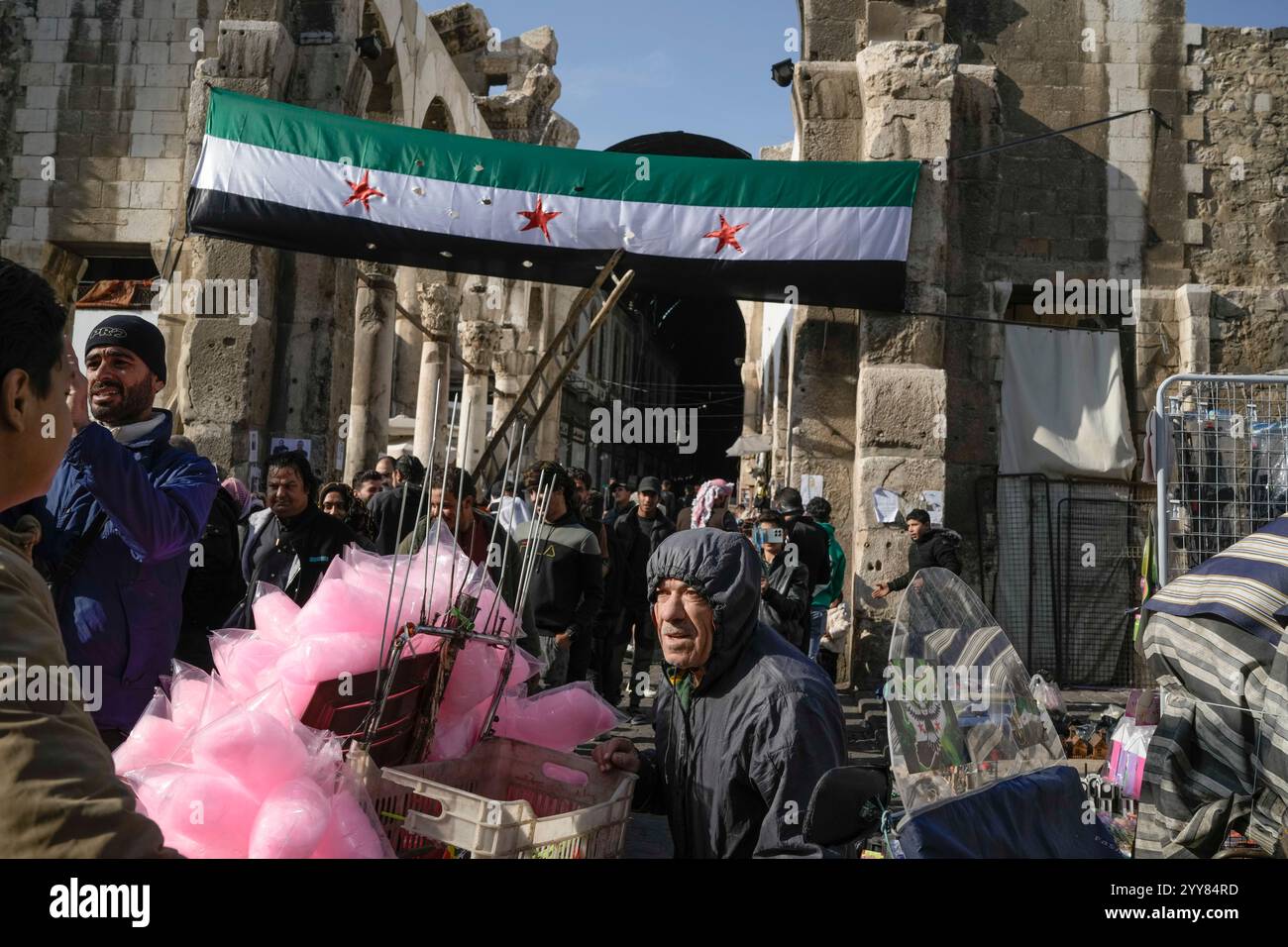 A Syrian "revolutionary" flag hangs at the entrance of the Umayyad ...
