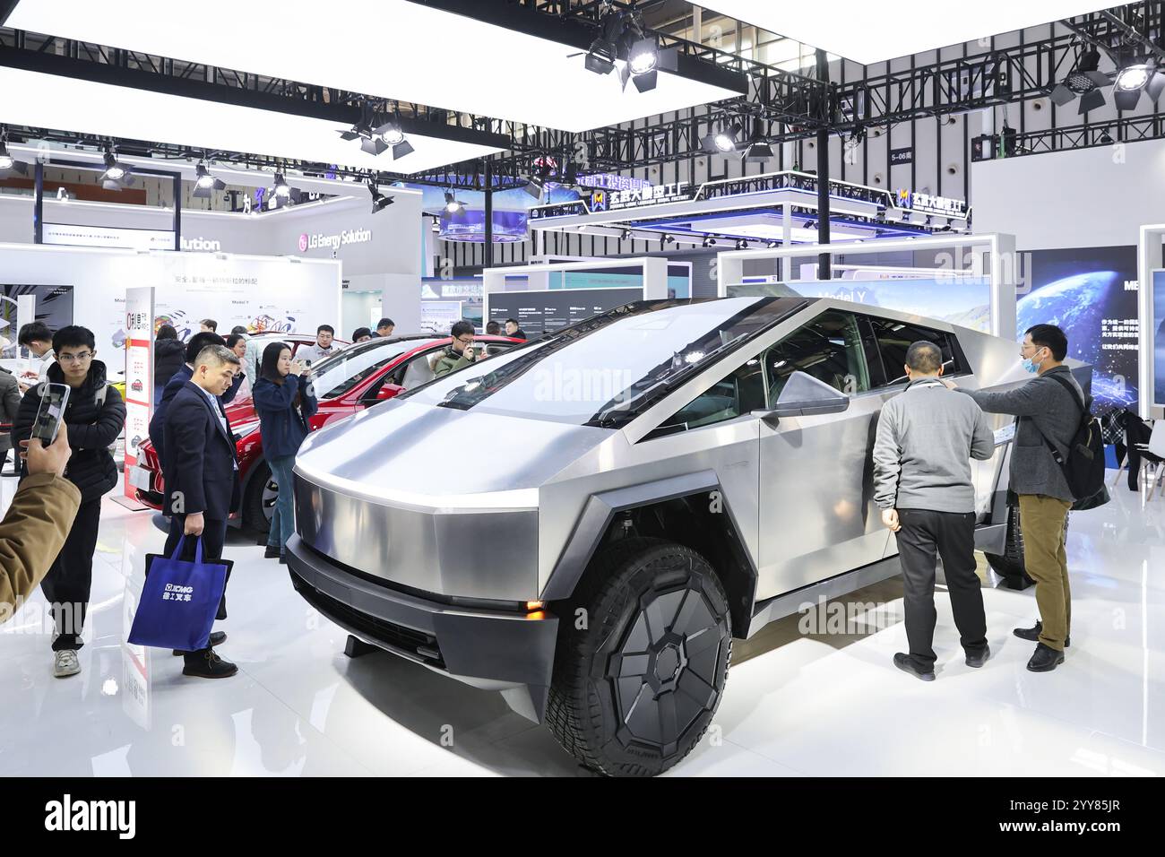 NANJING, CHINA - DECEMBER 20, 2024 - Visitors visit the Tesla booth at ...