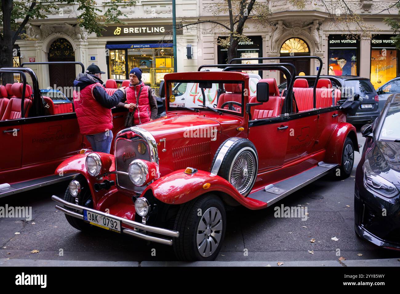 Prague, Czech Republic. October 3, 2024 - Classic red convertible taxi catering to tourists ...