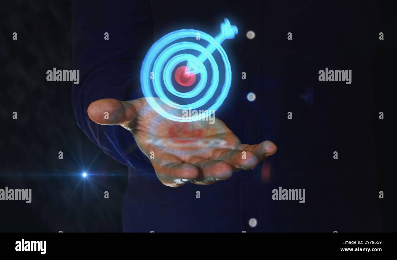 Target business strategy and success motivation 3d symbol over man hand ...