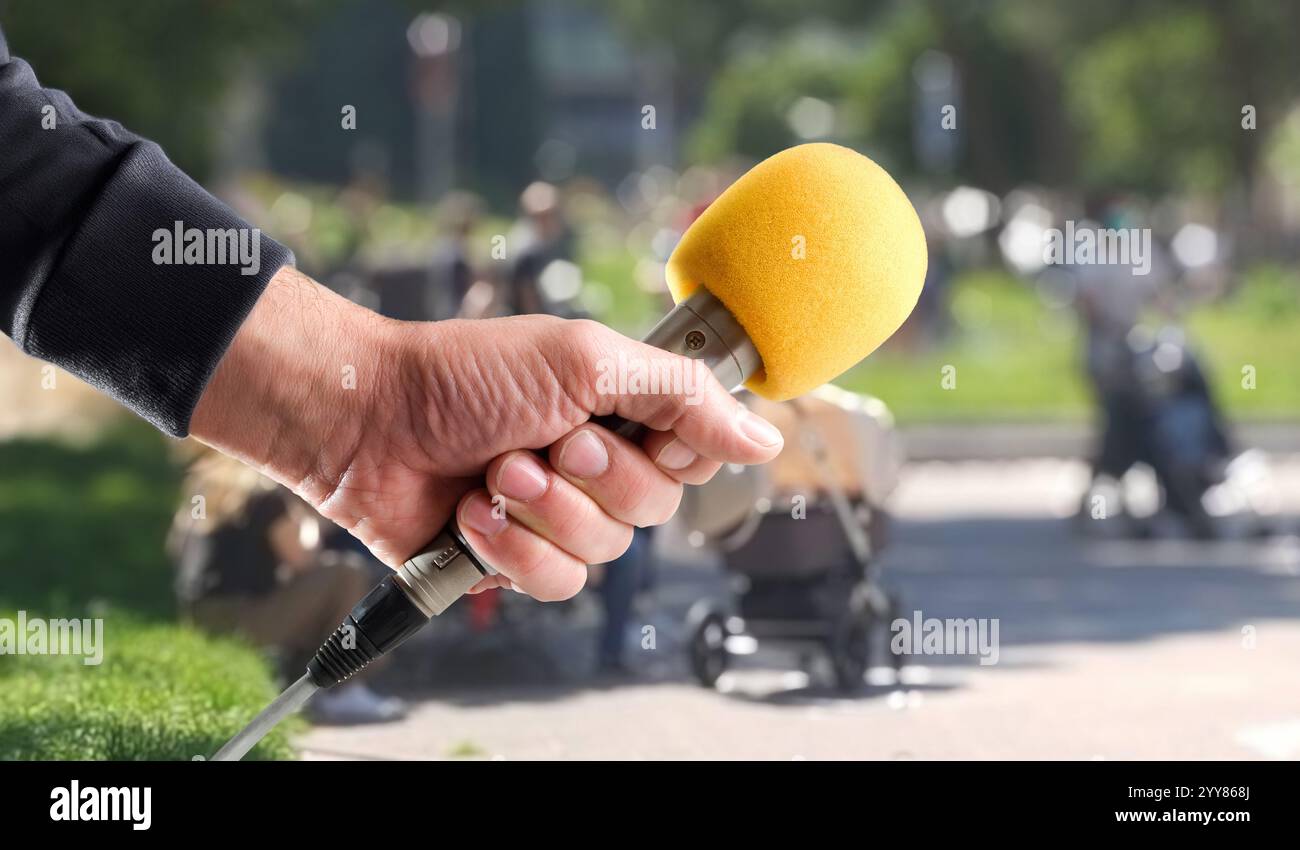 Hand holding microphone square hi-res stock photography and images - Alamy