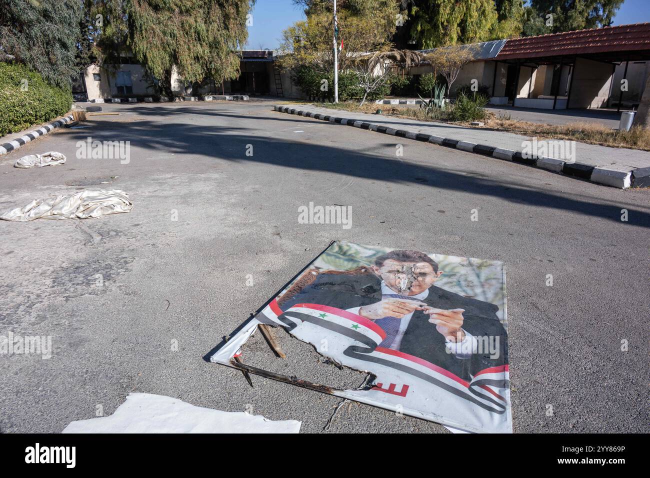 Damascus, Syria. 19th Dec, 2024. Destroyed portrait of Bashar El Assad ...