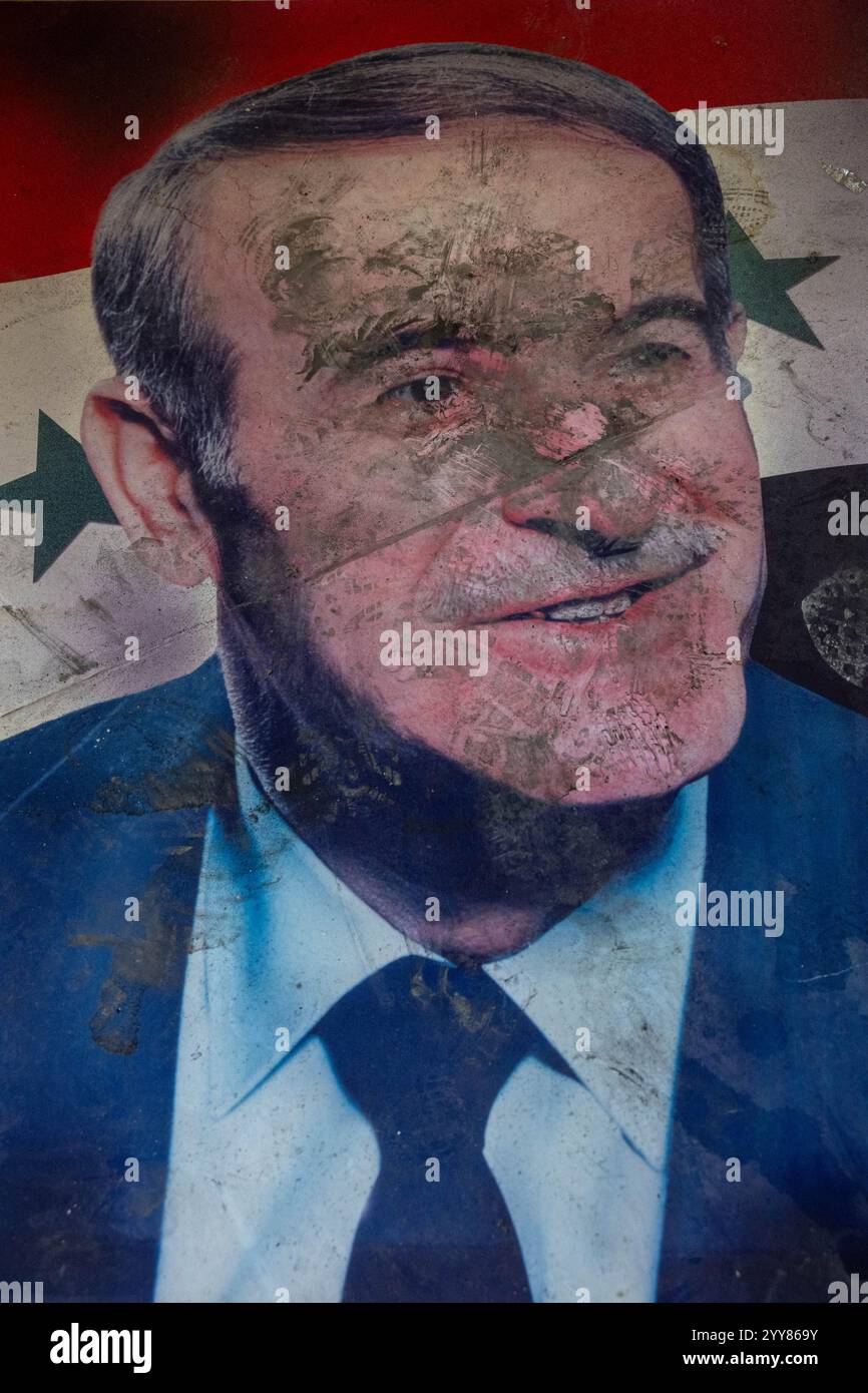 Damascus, Syria. 19th Dec, 2024. Destroyed portrait of Hafez El Assad ...