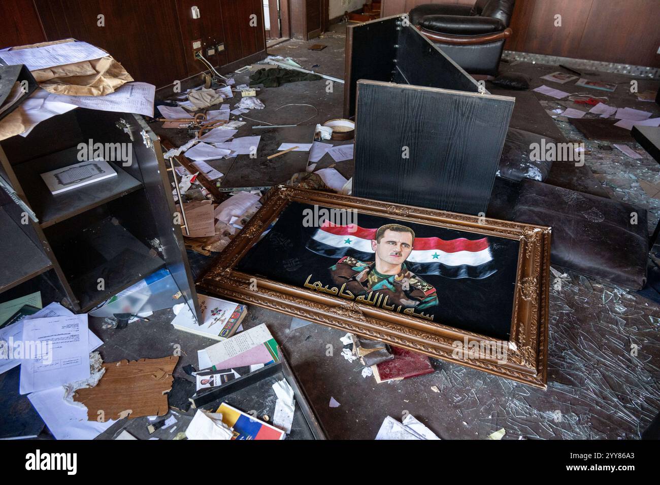 Damascus, Syria. 19th Dec, 2024. Destroyed portrait of Bashar El Assad ...