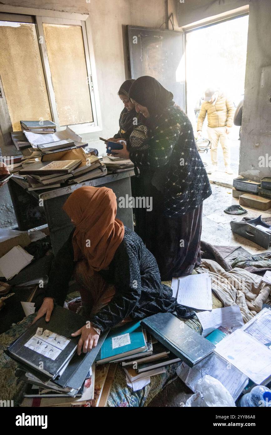 Damascus, Syria. 19th Dec, 2024. Syrian families looking for names of their missing ones, inside ...