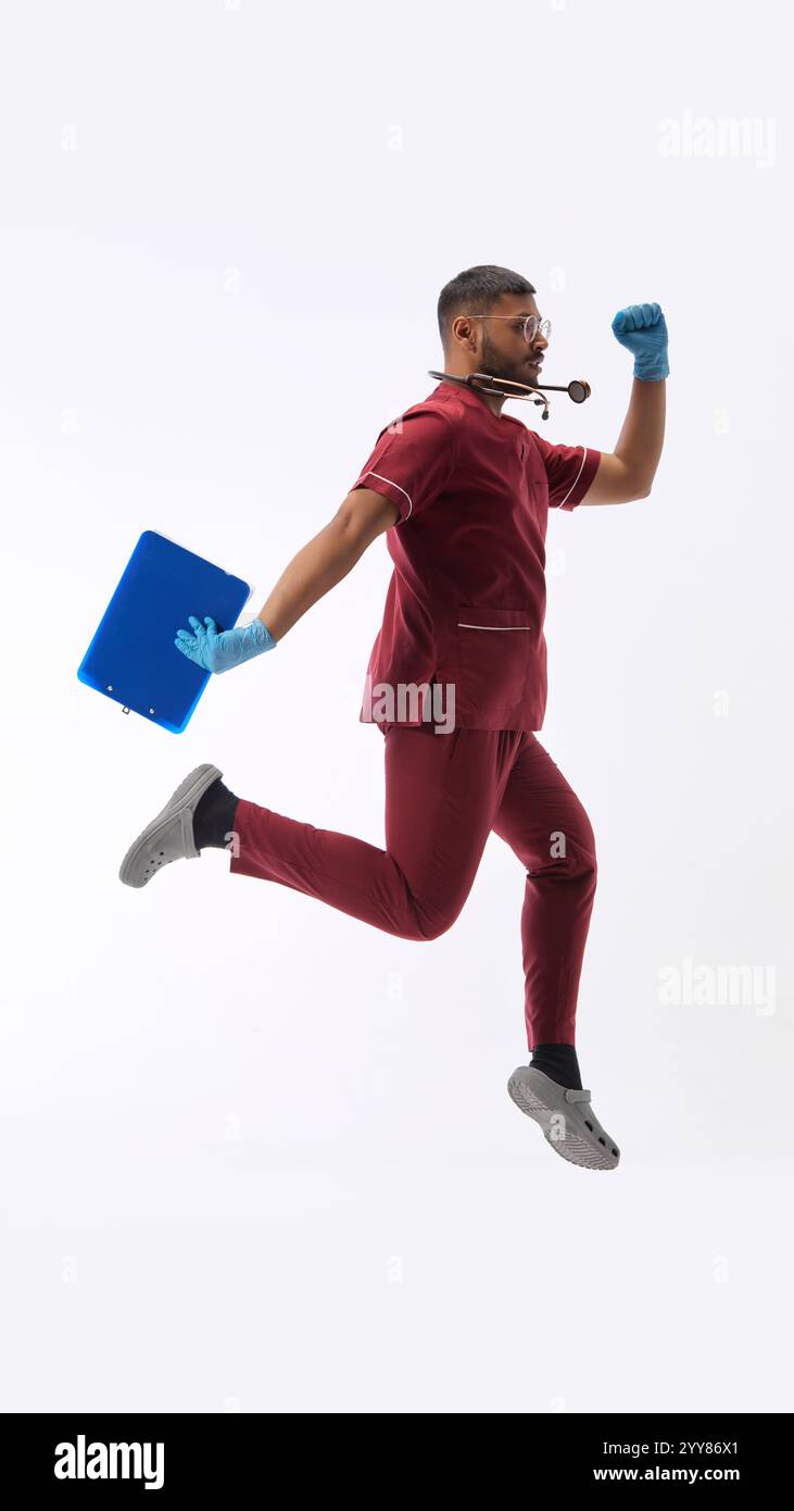 Young Indian man, dressed as doctor in uniform running, hurry up to ...