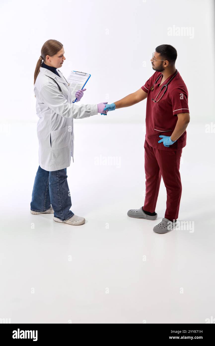 Aerial view of t professionals, doctors work in team and handshaking ...