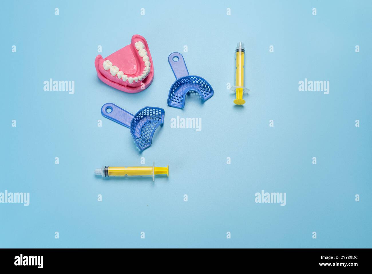 Dental flexible impression trays with a layout of the human jaw and ...