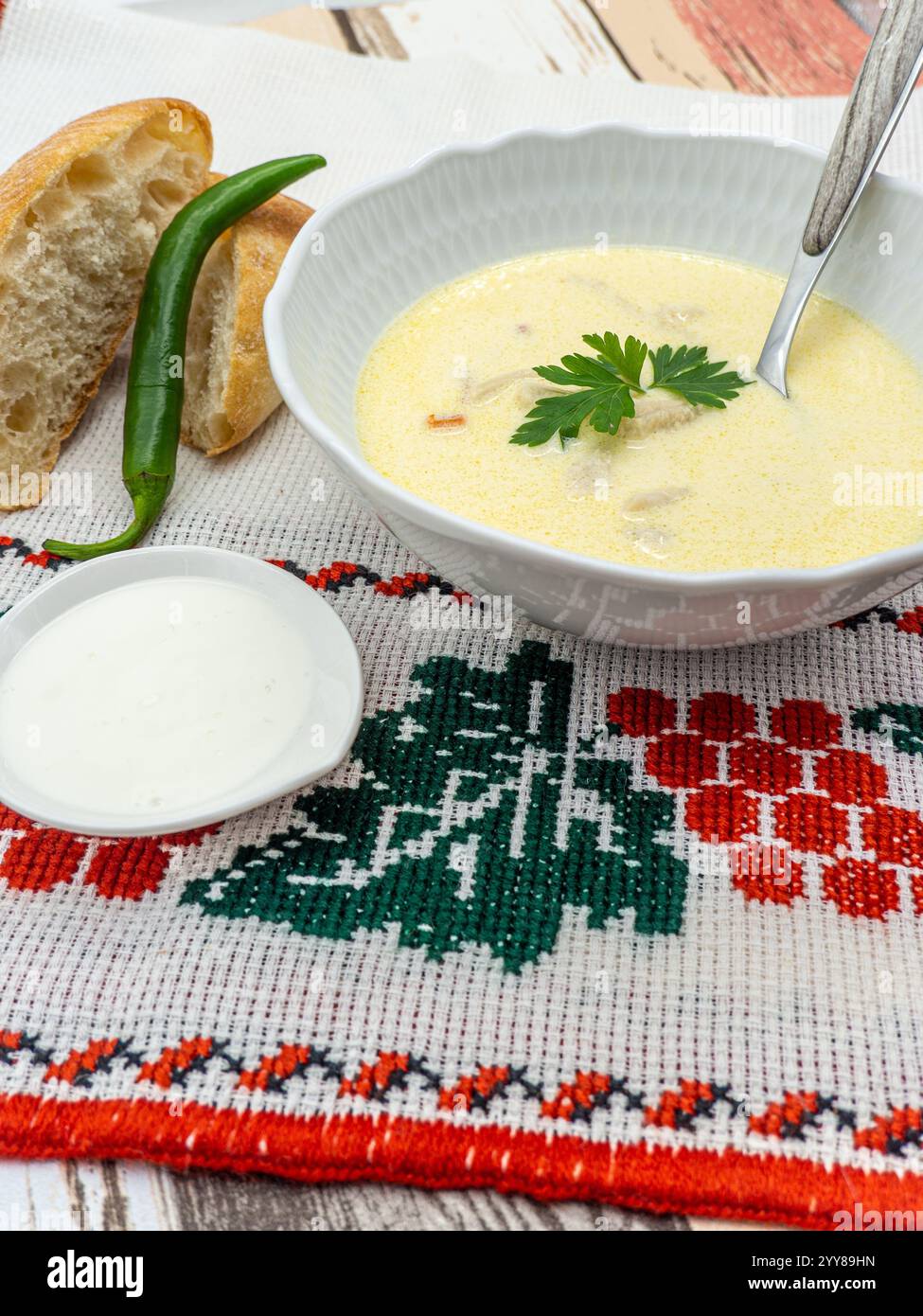 traditional romanian tripe soup known as ciorba de burta served with ...