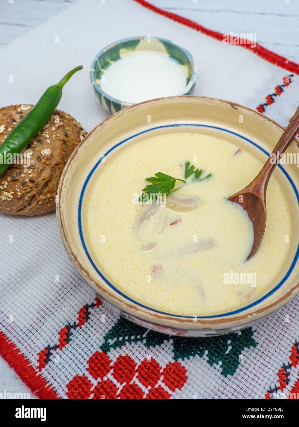 traditional romanian tripe soup known as ciorba de burta served with ...