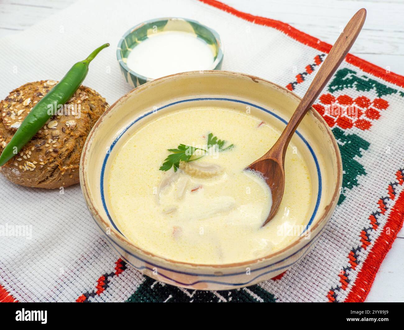 traditional romanian tripe soup known as ciorba de burta served with ...
