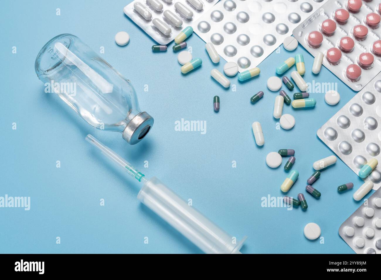 Glass bottle of liquid medicine, a plastic syringe for injection and a ...