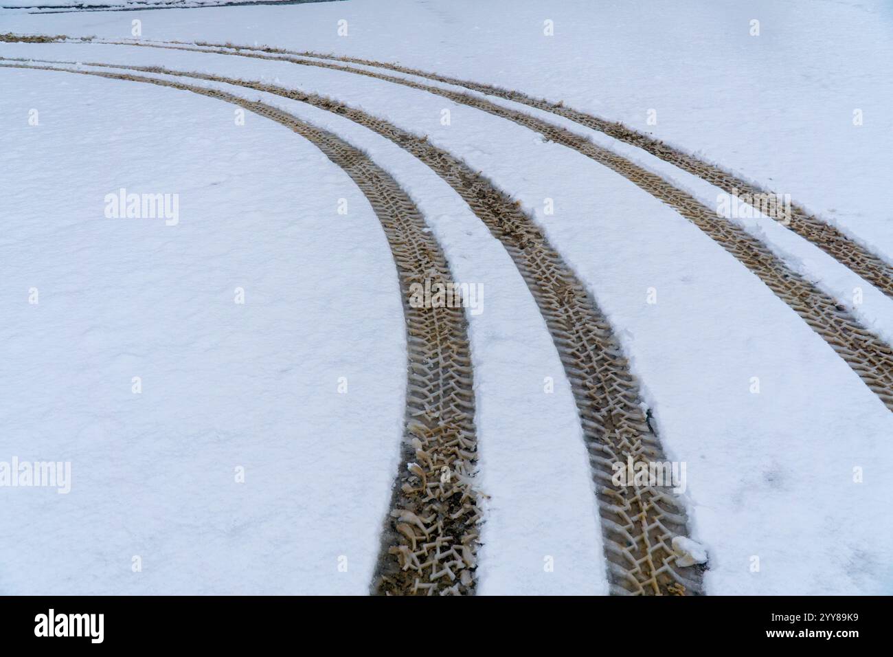 Tyre tracks made with aggressive tyre tread pattern on freshly fallen ...