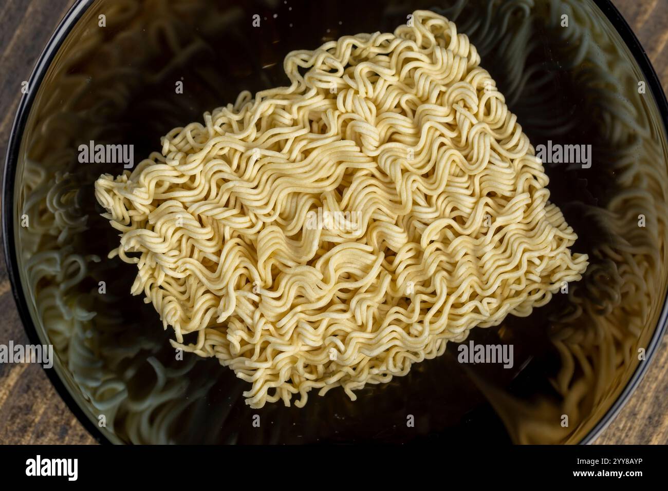 dry noodles during cooking, details of flour noodles with eggs during ...