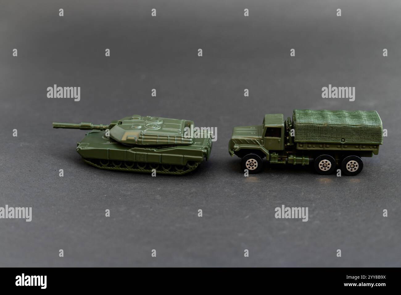 Green military tank model with military truck model Stock Photo - Alamy