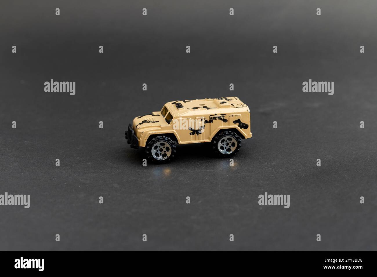 Toy military tan color vehicle side view Stock Photo - Alamy