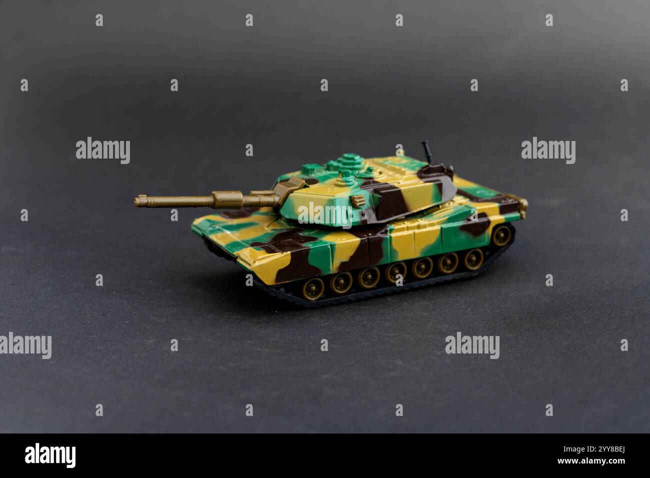 Green and brown camouflage tank model on dark background Stock Photo ...