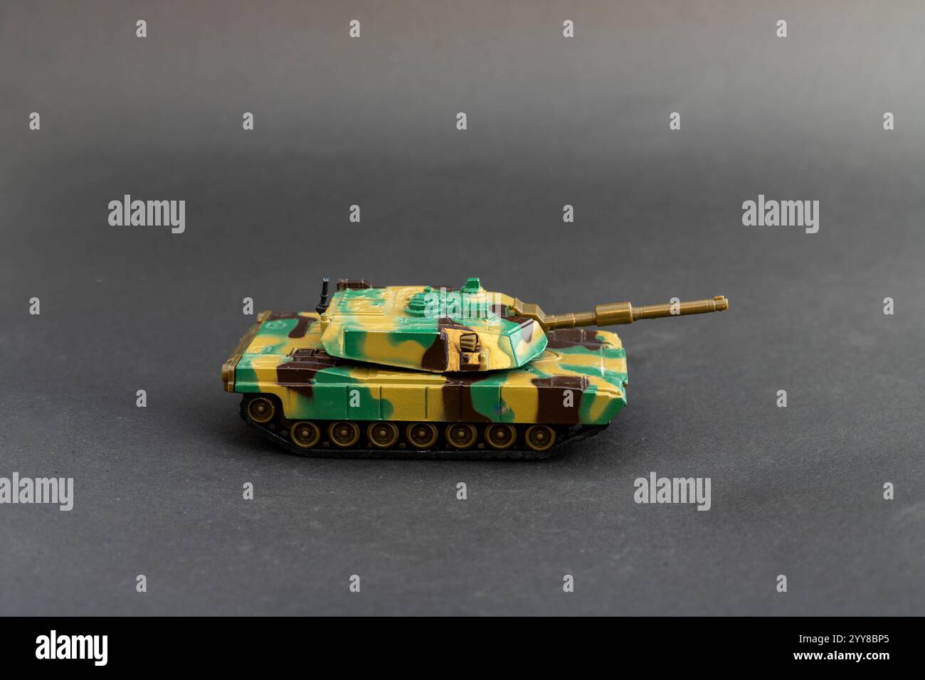 Toy miniature military tank model side view Stock Photo - Alamy