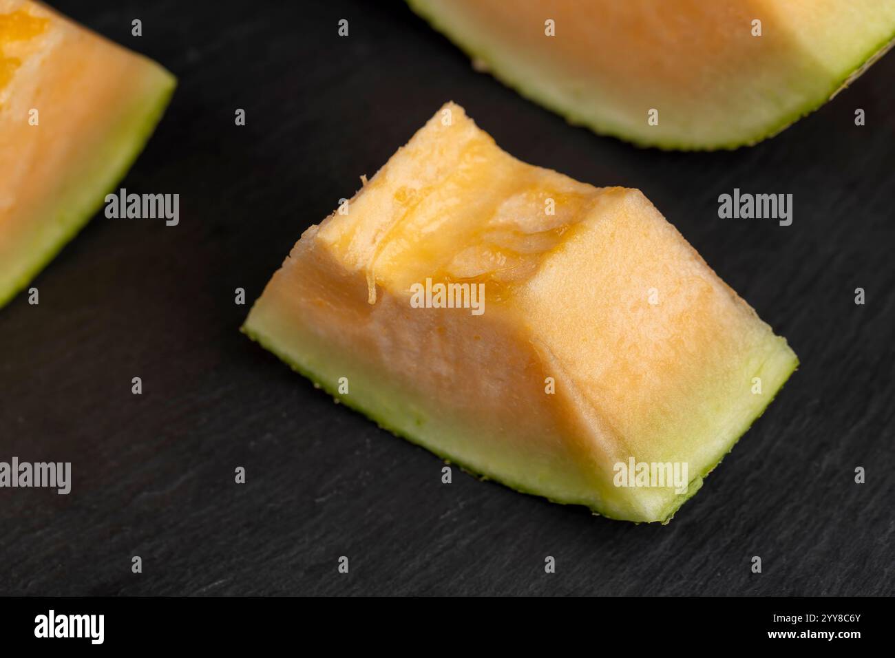 fresh melon cut into pieces, slicing sweet orange melon into pieces ...