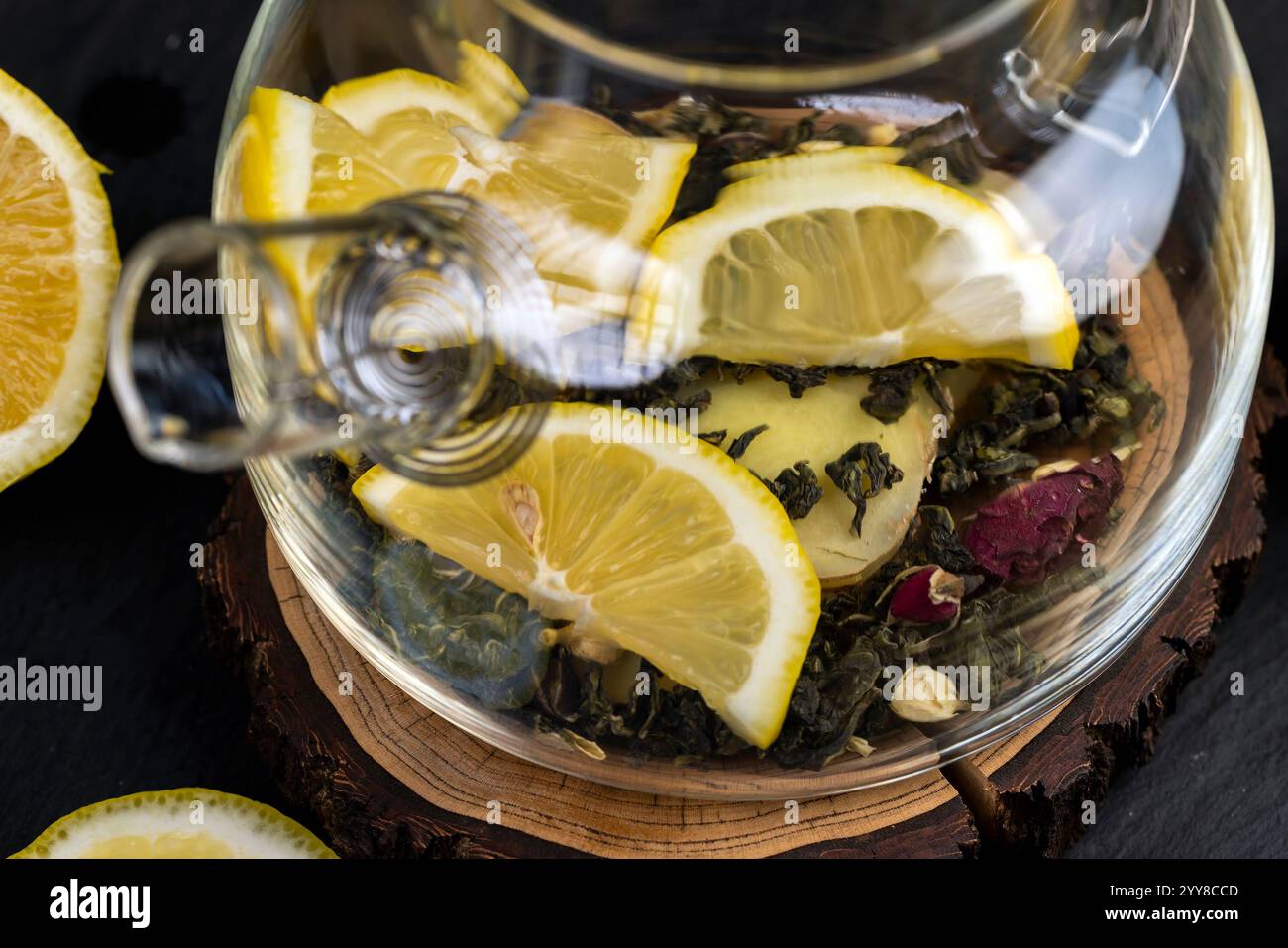 making green tea in a glass teapot, green tea with ginger and lemon ...