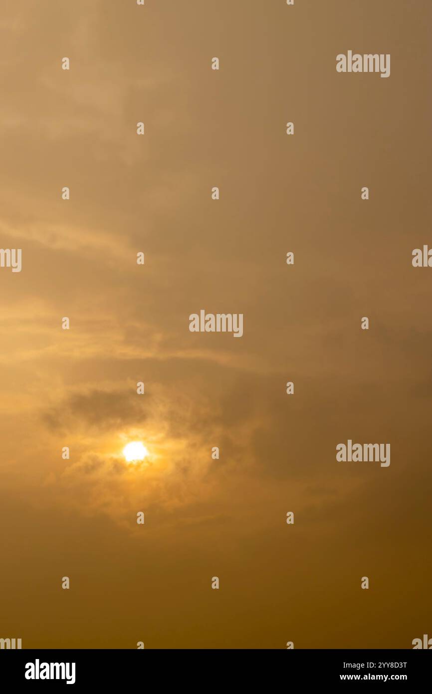 yellow sky with a white spot from the sun at sunset, a beautiful ...