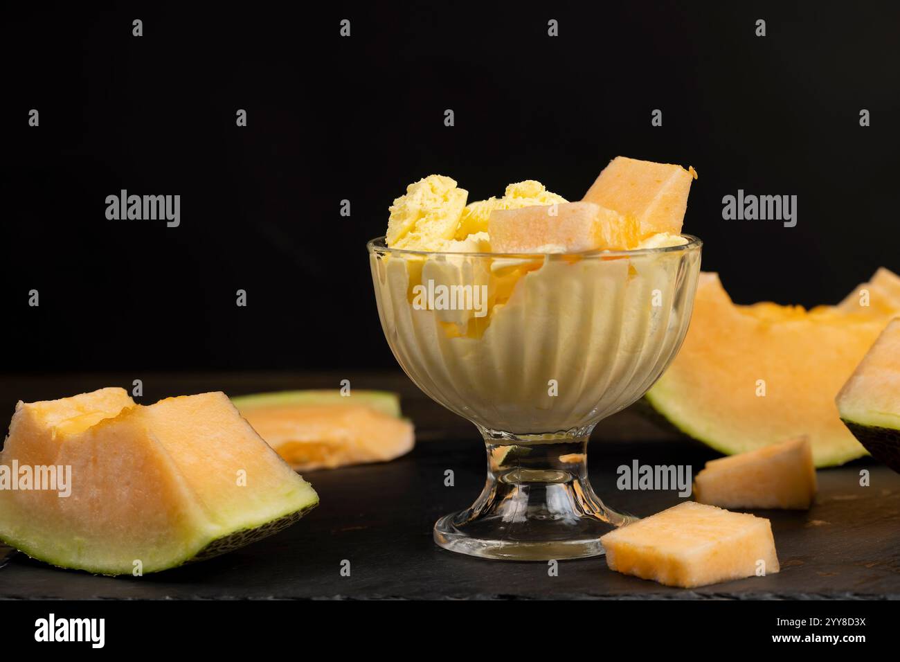 melon flavored ice cream and ripe orange melon cut into pieces, sweet ...