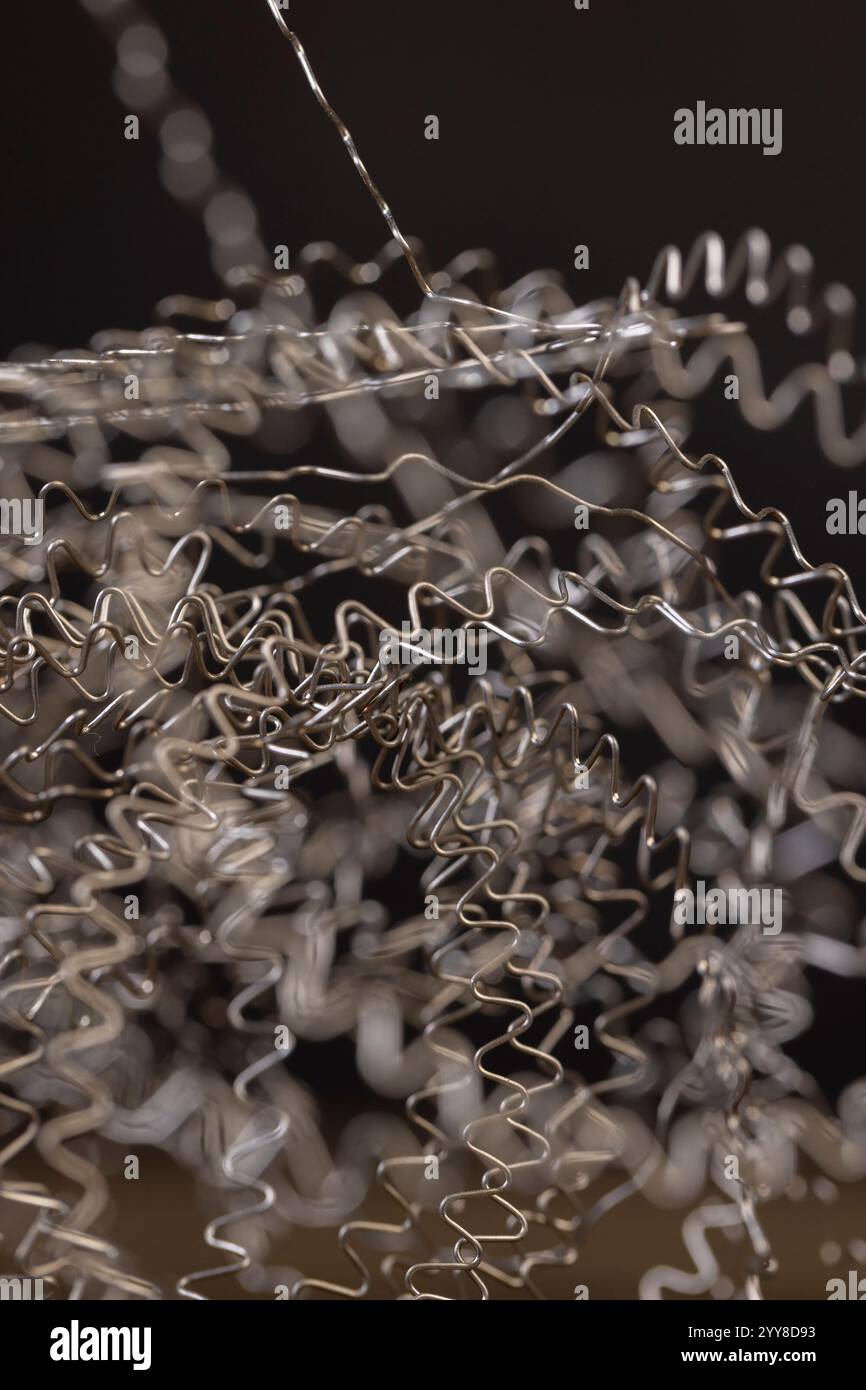 old curved heating wire made of metal in dust and pollution Stock Photo ...
