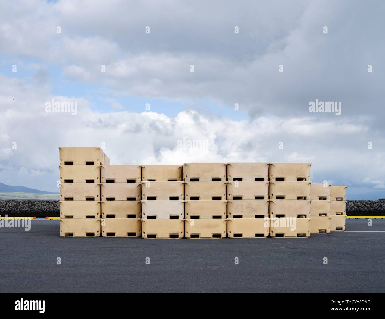 Stack of plastic fish tubs on an open lot Stock Photo - Alamy