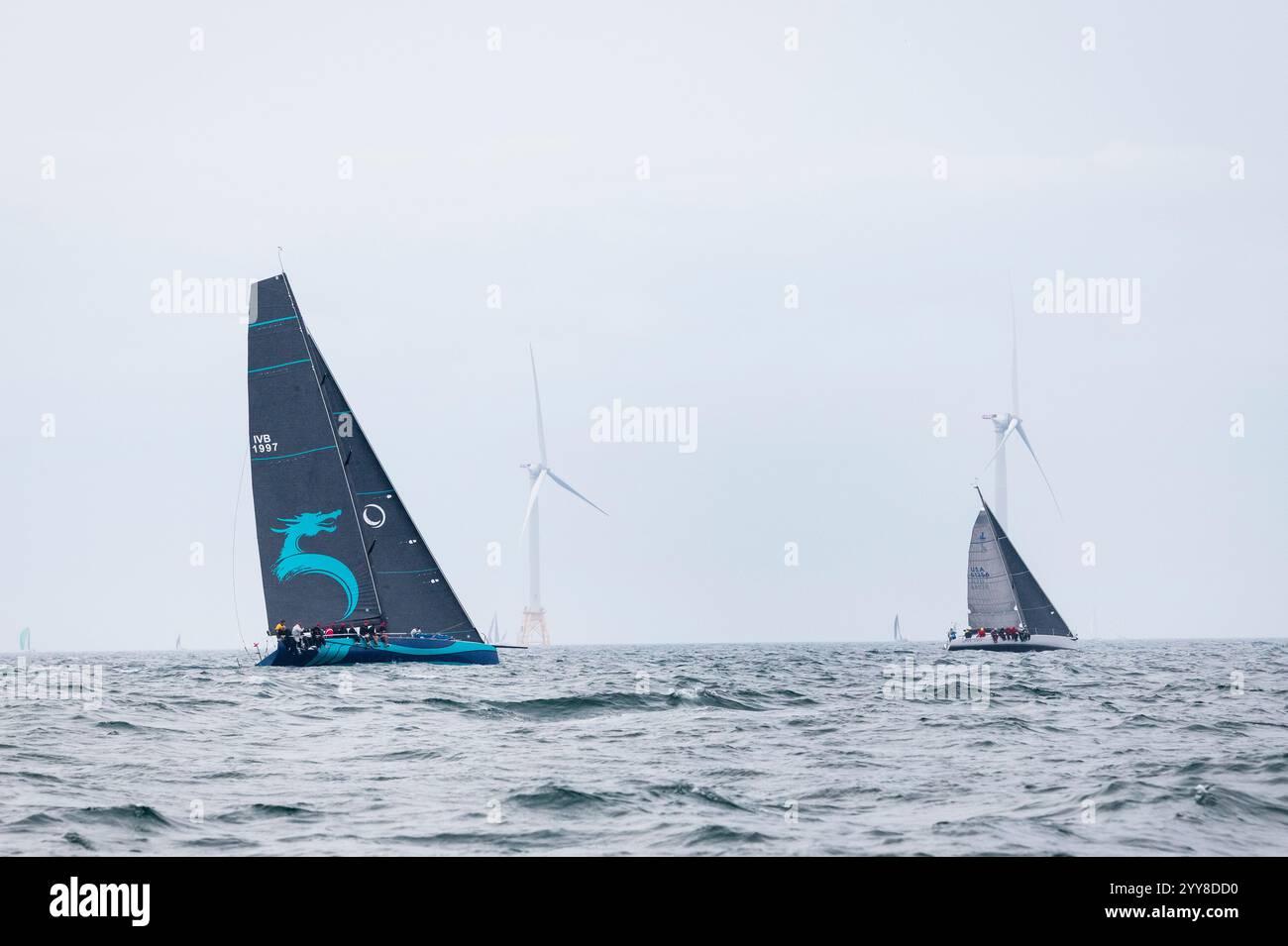 Boats sailing by Wind Turbines in the Block Island Race Week regatta ...
