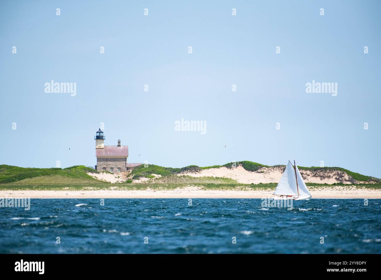 Boat sailing by North Lighthouse in the Block Island Stock Photo - Alamy