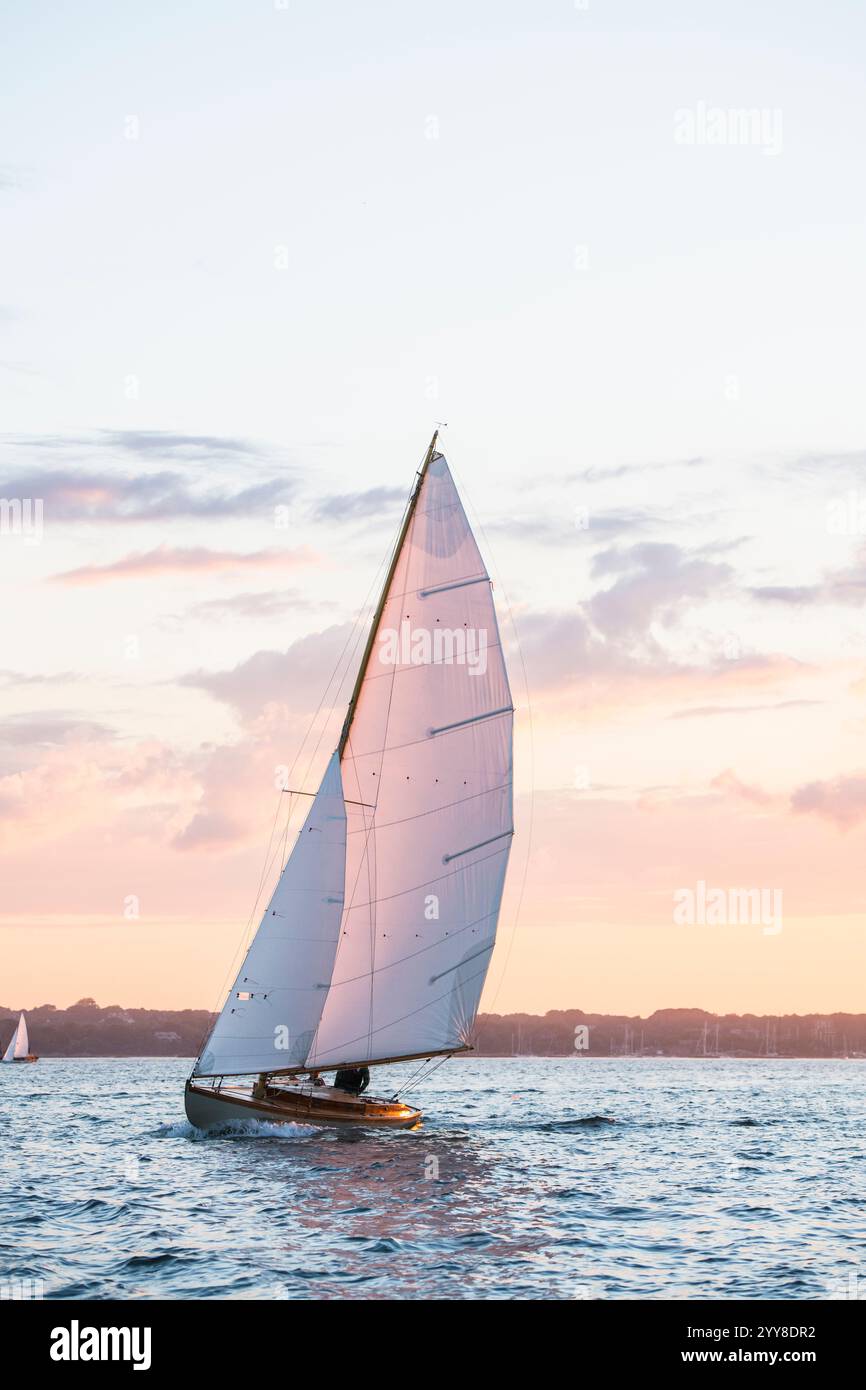 Classic Boat sailing at sunset in Newport Harbor Stock Photo - Alamy