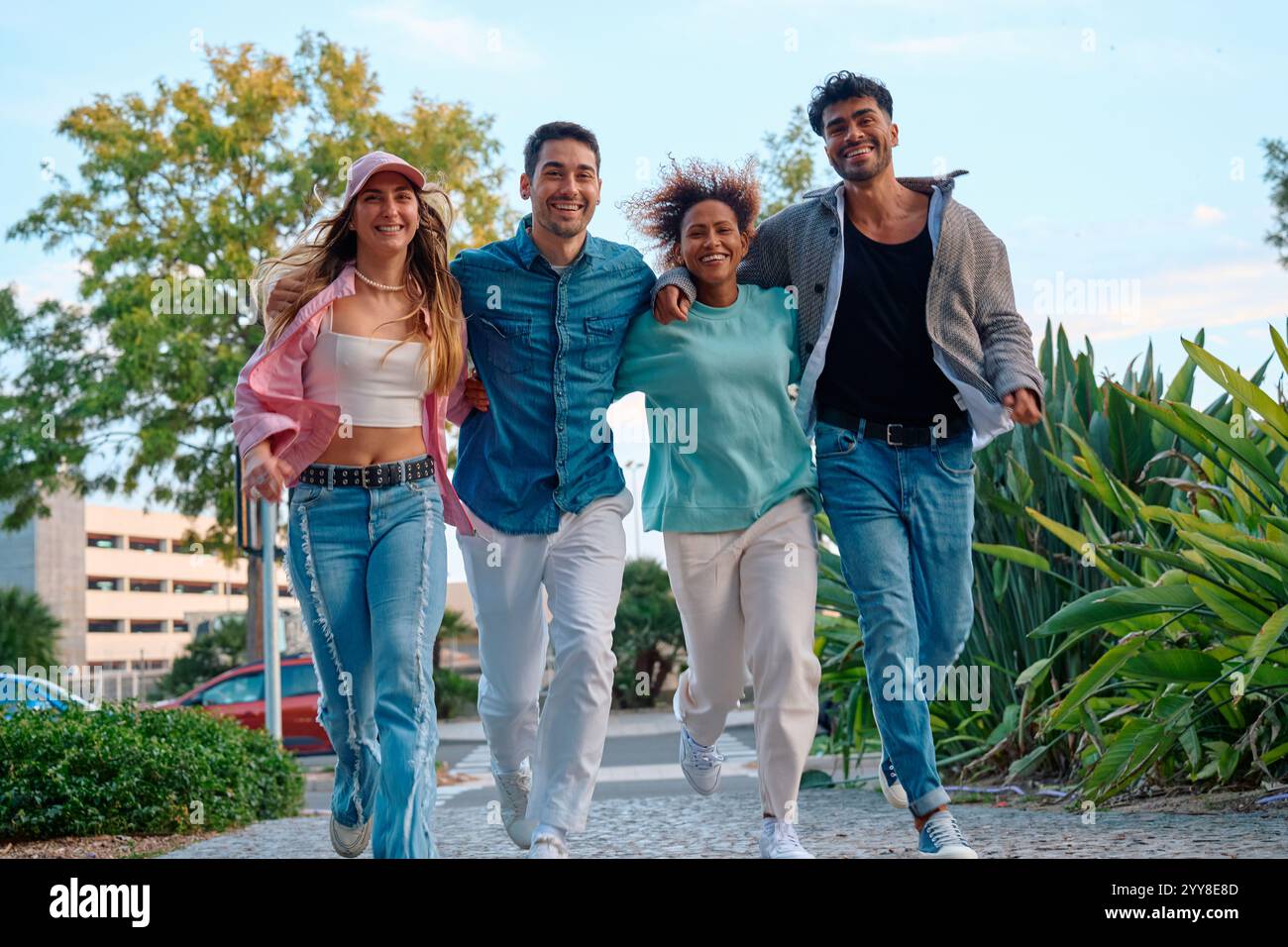 Female group walking urban park hi-res stock photography and images - Alamy