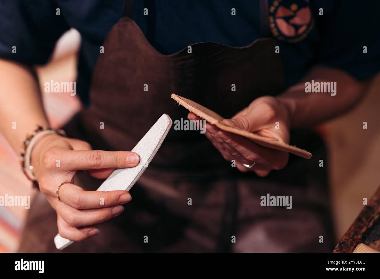 Leather artisan polishing edges hi-res stock photography and images - Alamy