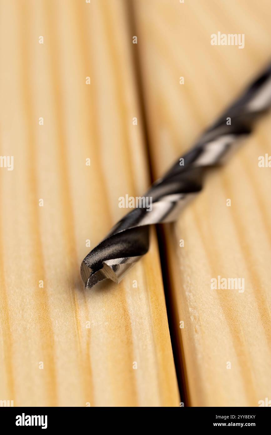 pine wood and metal drill bit for construction work, metal drill bit for creating holes in a ...