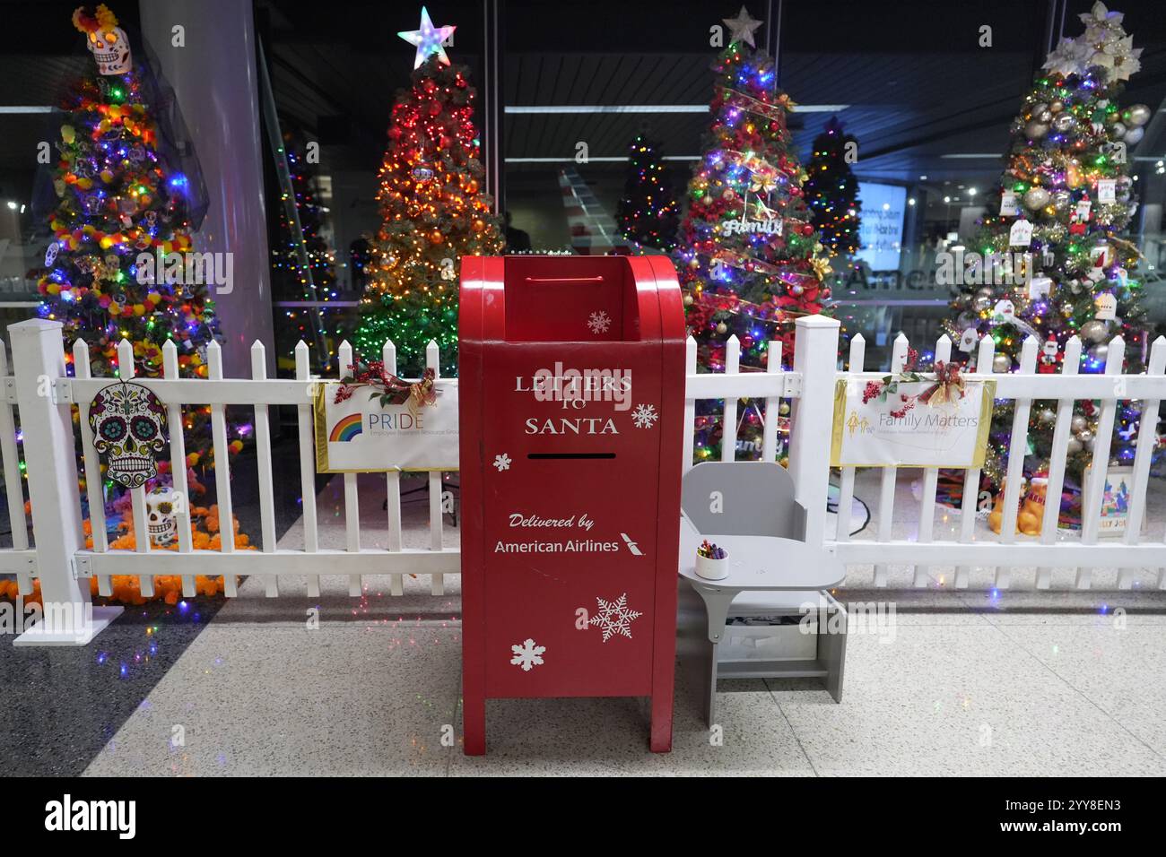 A Letters to Santa Claus mailbox and Christmas trees in Terminal 3 of ...