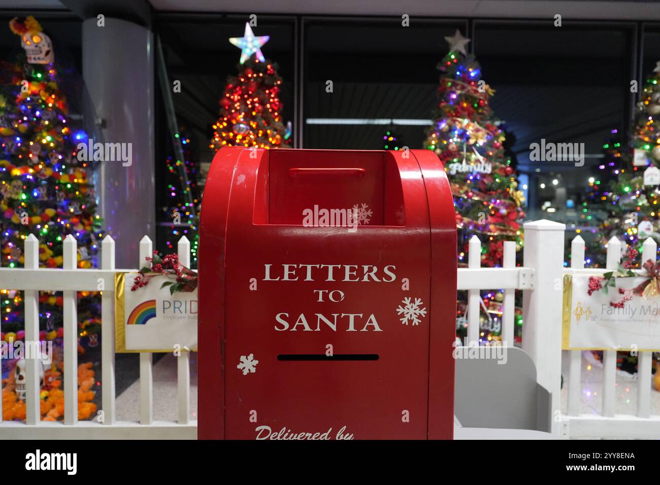 A Letters to Santa Claus mailbox and Christmas trees in Terminal 3 of ...