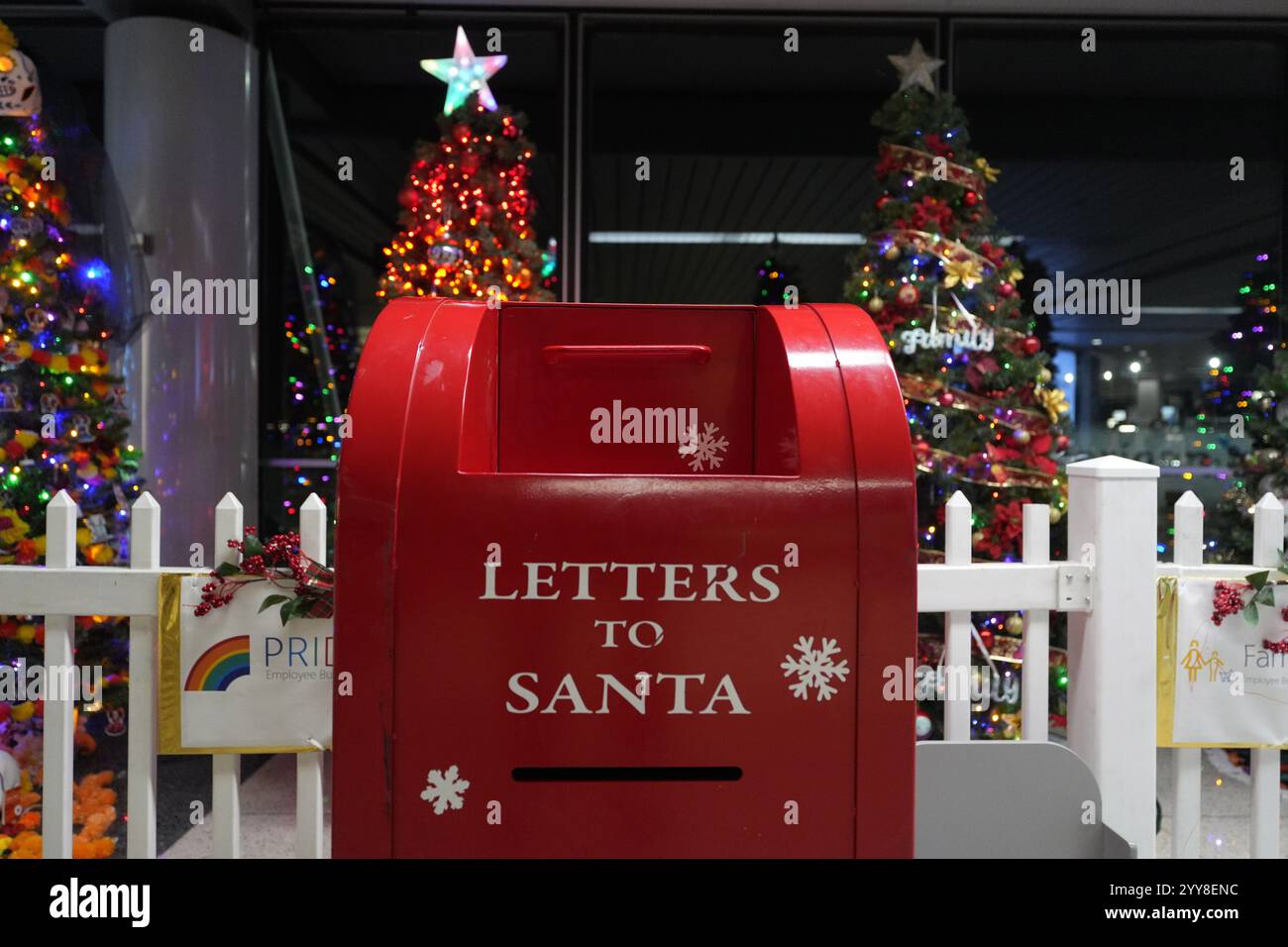 A Letters to Santa Claus mailbox and Christmas trees in Terminal 3 of ...