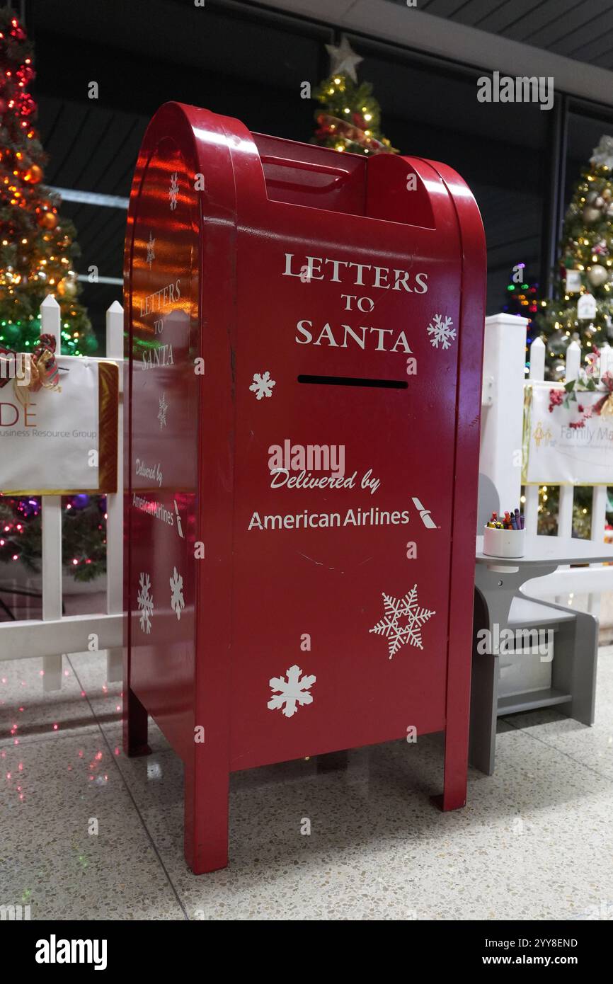 A Letters to Santa Claus mailbox and Christmas trees in Terminal 3 of ...