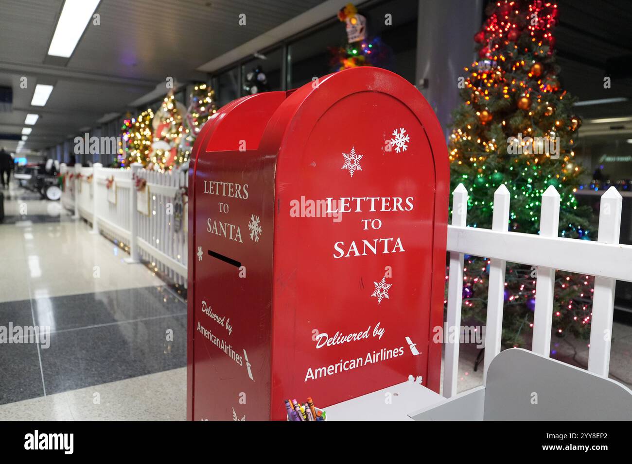 A Letters to Santa Claus mailbox and Christmas trees in Terminal 3 of ...