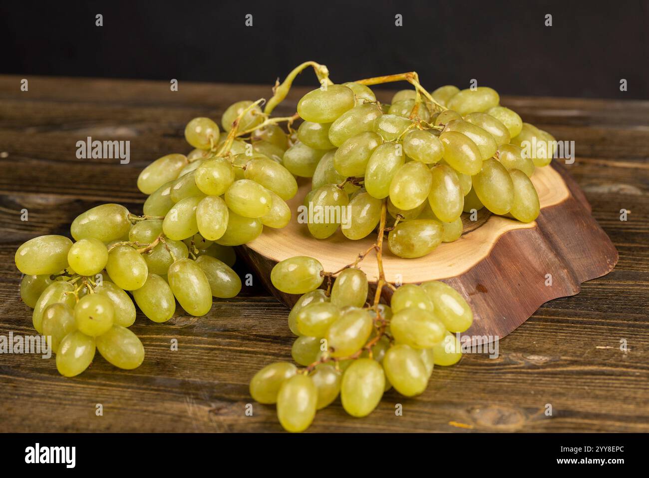 grapes are on the table, a large number of ripe green grapes are on the ...