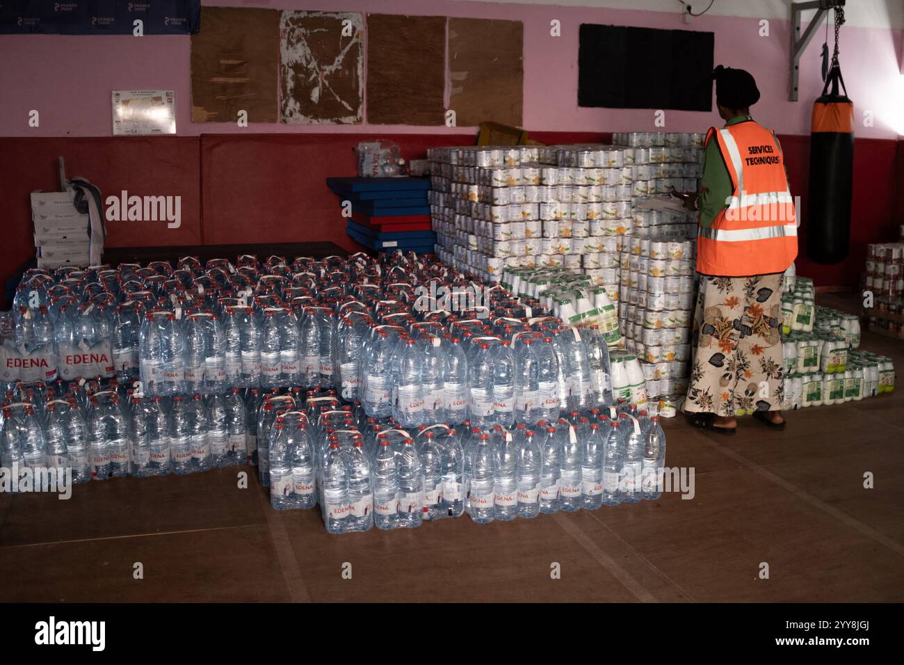 Pamandzi, Mayotte. 19th Dec, 2024. People wait for water and food ...