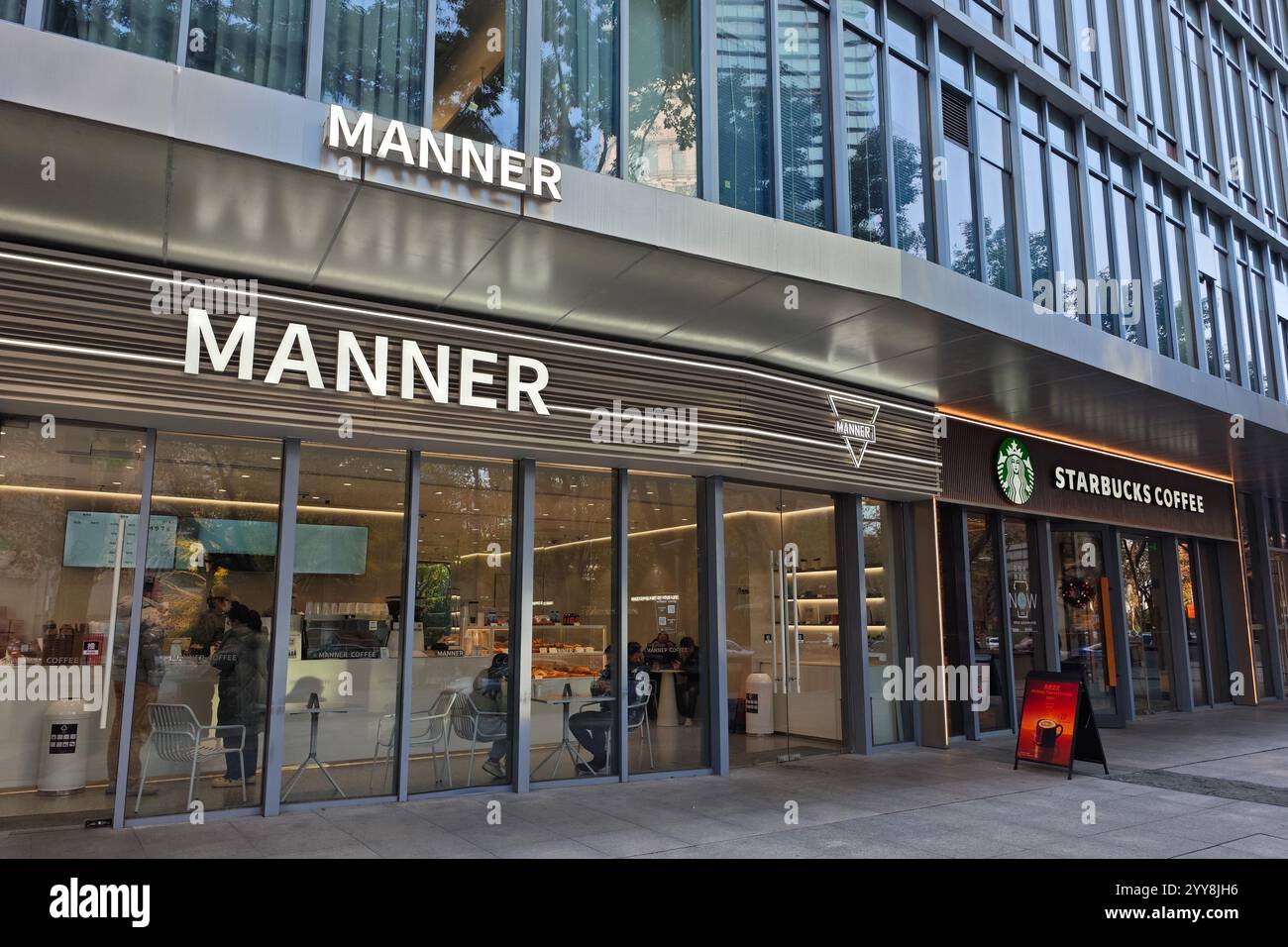 SHANGHAI, CHINA - DECEMBER 20, 2024 - A Starbucks and Manner coffee ...