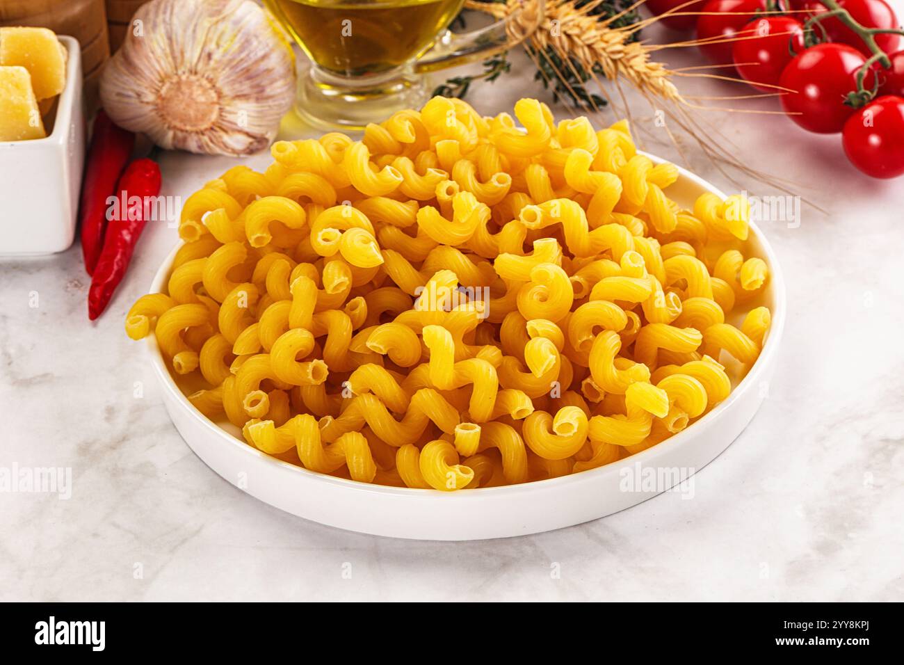 Italian cuisine - dry cellentani pasta for cooking Stock Photo - Alamy