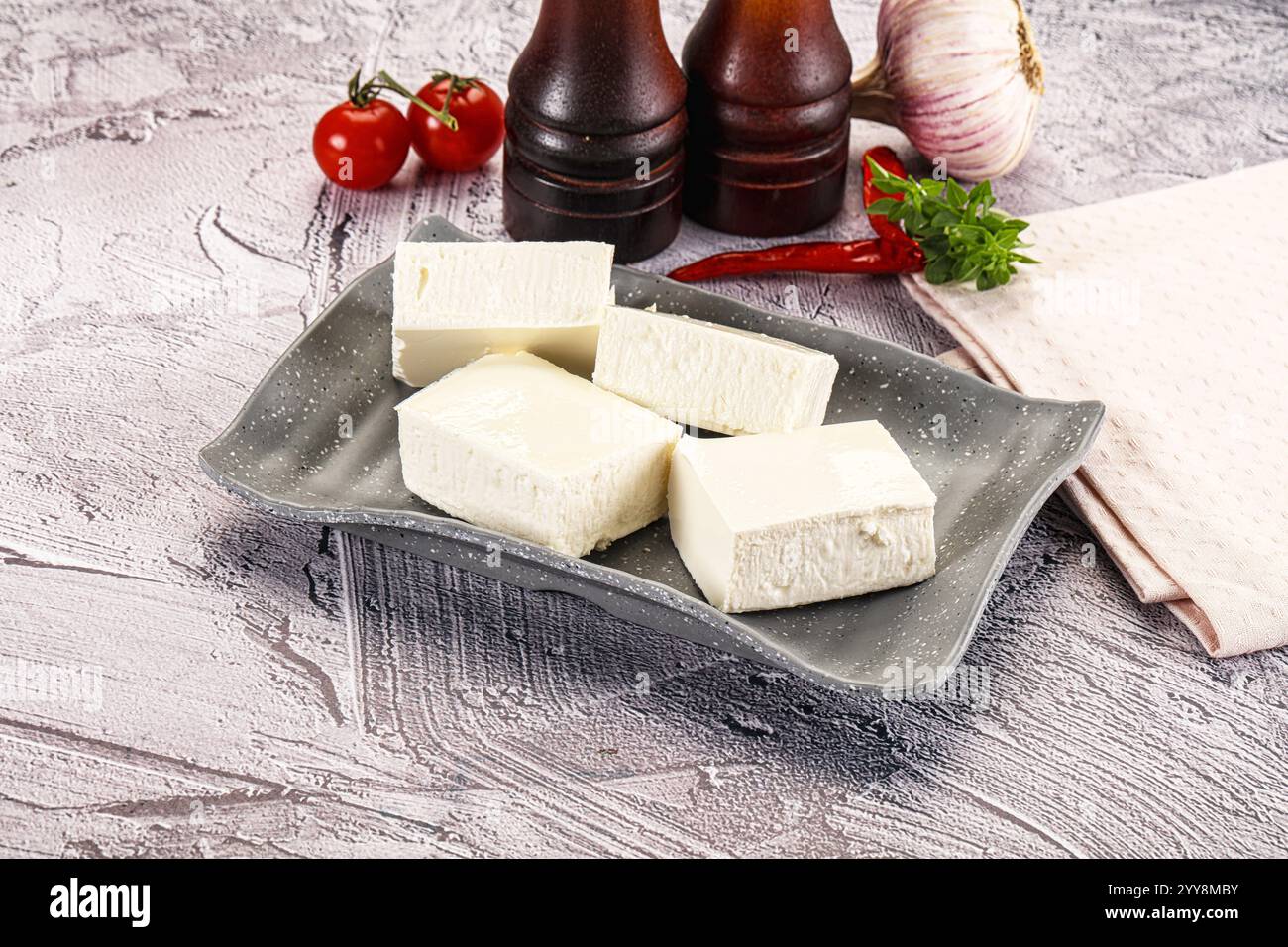 Greek traditional cuisine - Feta cheese bricks Stock Photo - Alamy