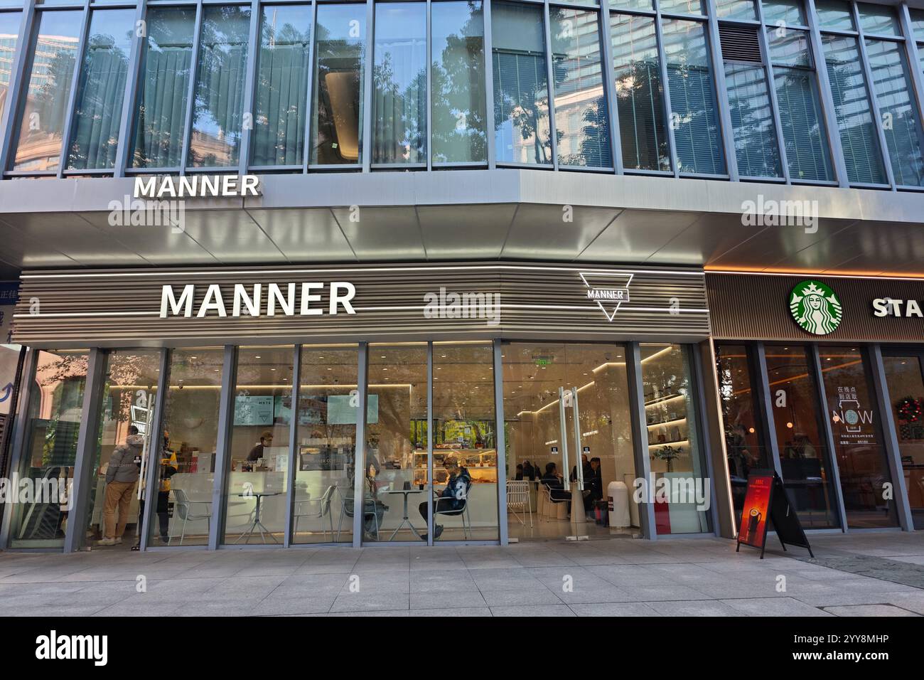 SHANGHAI, CHINA - DECEMBER 20, 2024 - A Starbucks and Manner coffee ...