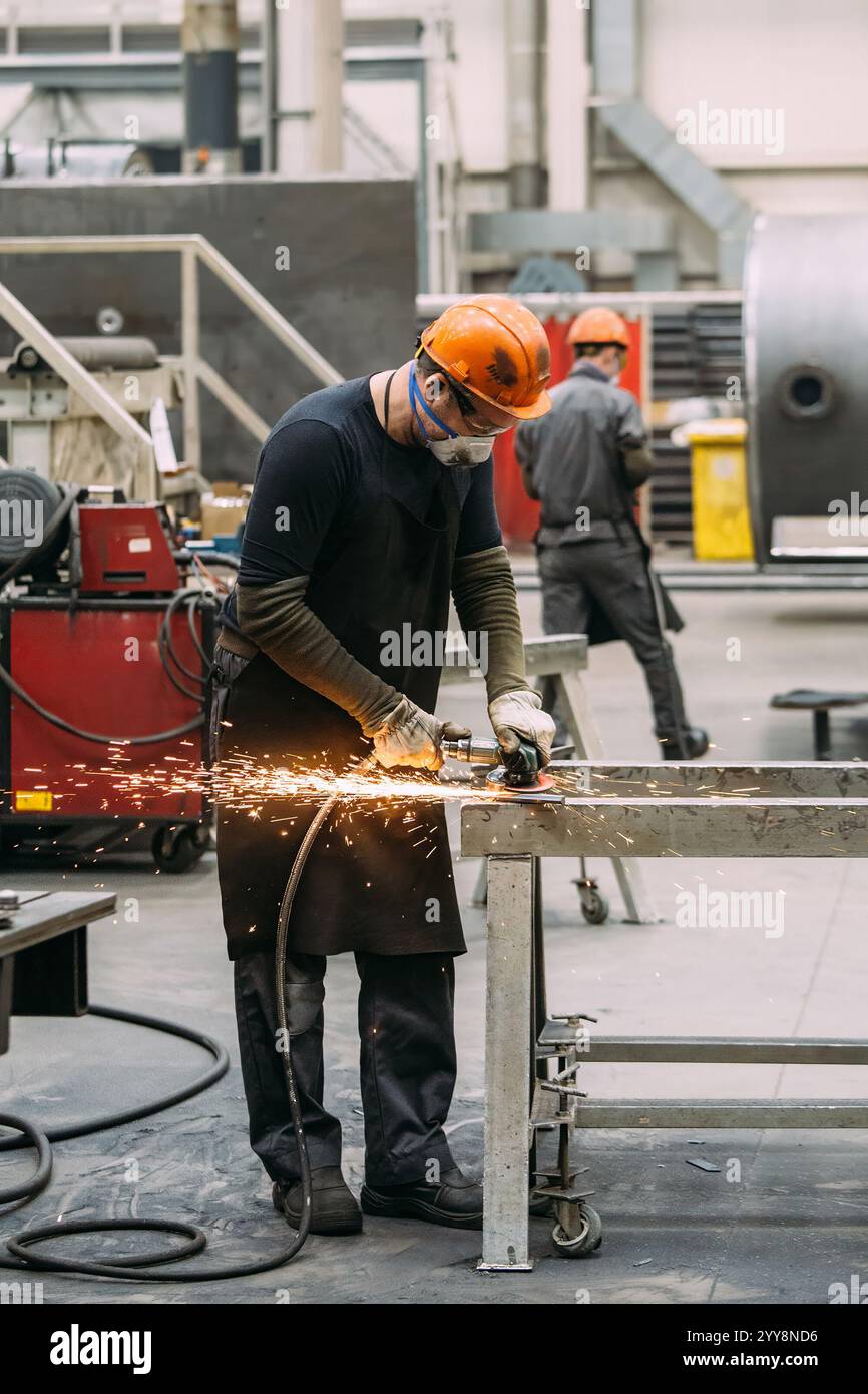 Worker cleans metal part hi-res stock photography and images - Alamy