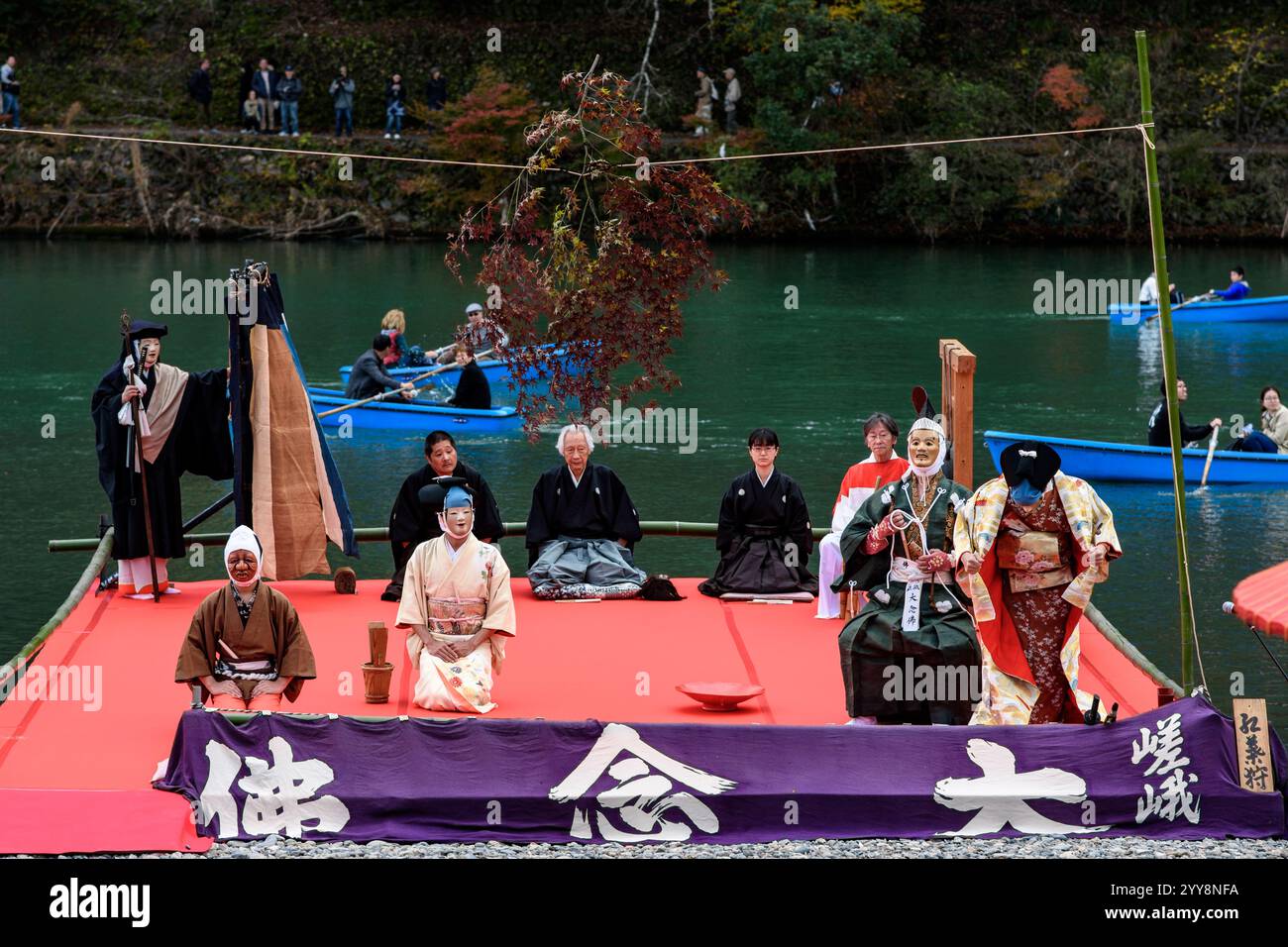 Traditional boat ride on Katsura River, near Arashiyama park, people ...