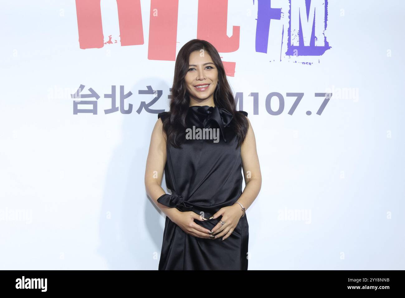 Taipei. 20th Dec, 2024. Taiwanese female singer Eve Ai attends a radio ...