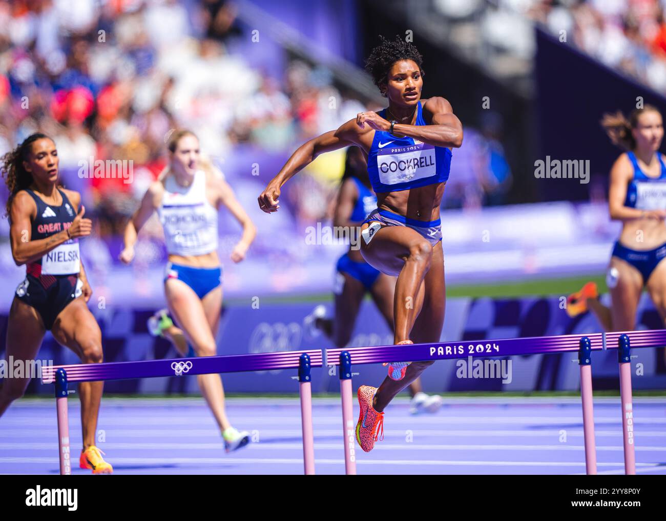 Anna Cockrell participating in the 400 meters hurdles at the Paris 2024 ...