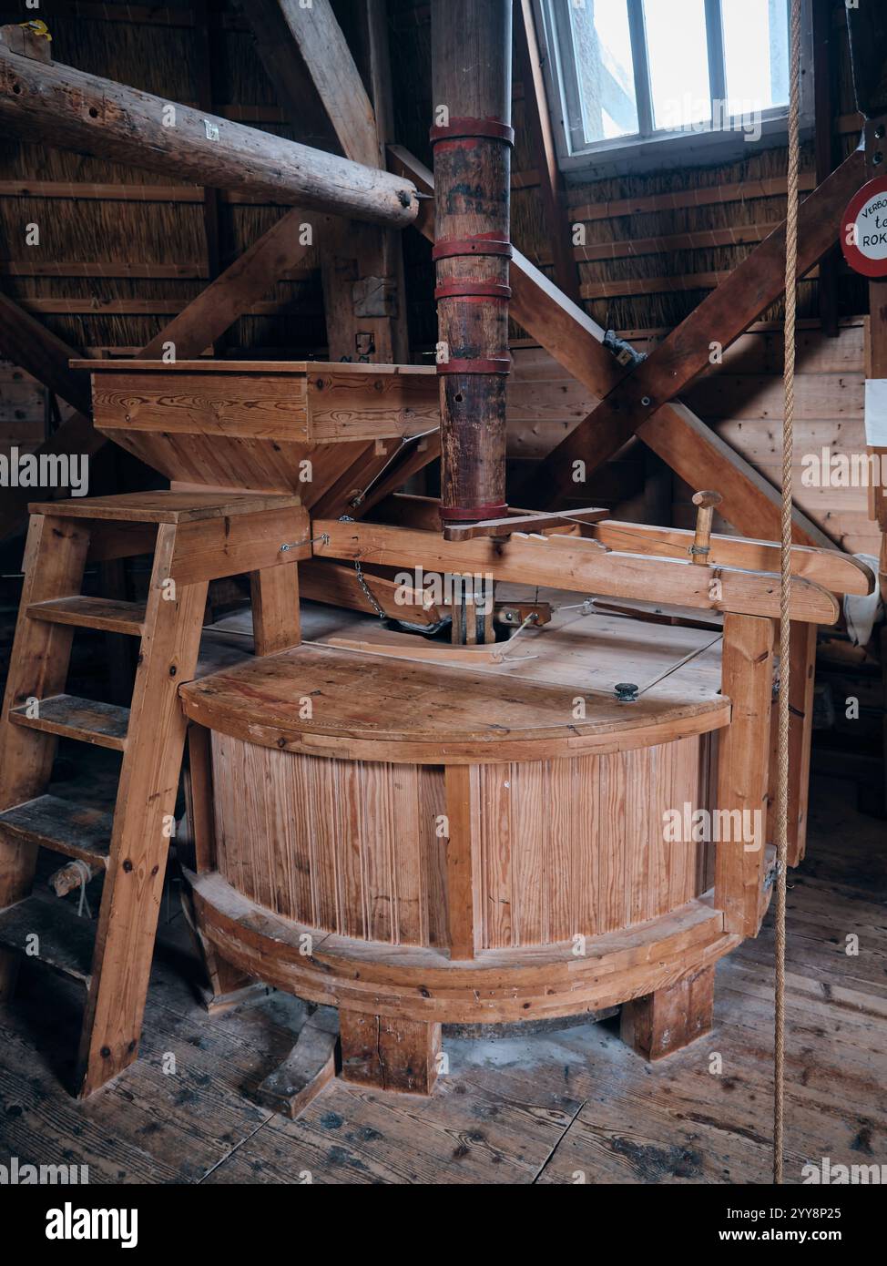 Close-up of the wooden millstone machinery inside De Weyert windmill ...